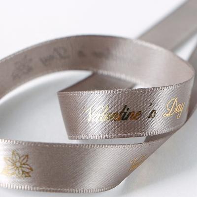China MSD Single Face Style Custom Solid Color Satin Ribbon with Gold Logo Printing for sale