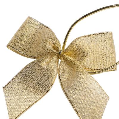 Cina 8cm metallic gold ribbon bow per decorazioni artigianali 100% poliestere design elegante in vendita