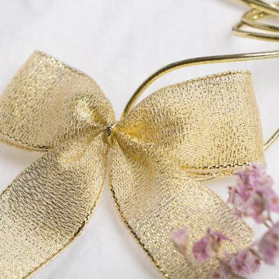 Cina 8cm metallic gold ribbon bow per decorazioni artigianali 100% poliestere design elegante in vendita