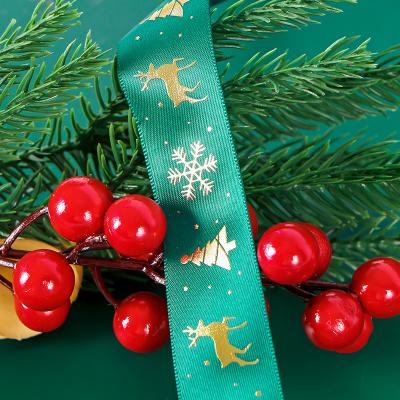 China 25mm Green Satin Ribbon with Christmas Tree Deer and Snowflake Gold Print 100 Yards Roll for sale