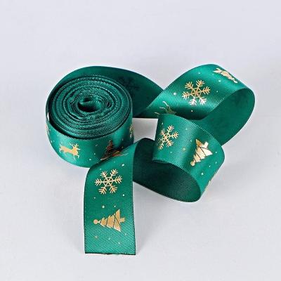 China 25mm Green Satin Ribbon with Christmas Tree Deer and Snowflake Gold Print 100 Yards Roll for sale