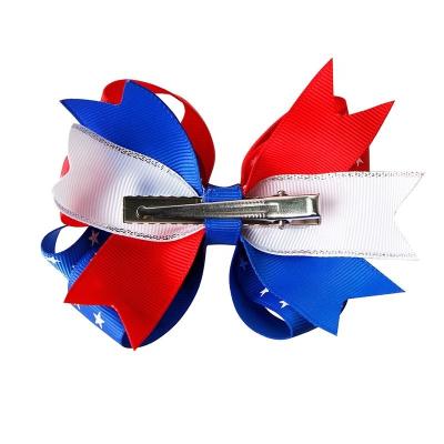 Cina 4 Luglio Festa di moda clip capelli con bandiera bianca americana Nastro arco in stile blu in vendita