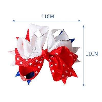 Cina 4 Luglio Festa di moda clip capelli con bandiera bianca americana Nastro arco in stile blu in vendita