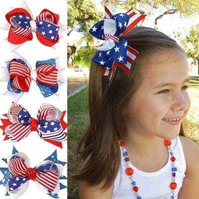 Cina 4 Luglio Festa di moda clip capelli con bandiera bianca americana Nastro arco in stile blu in vendita