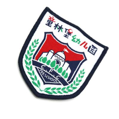 Cina Distintivo di scuola ritenuto del tessuto Logo Custom Sew On Patches per i rivestimenti in vendita