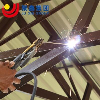 Cina Q355 Q345 Fabbrica di cornici metalliche Prefabbricato Edifici di garage metallici Resistenti alla neve Non arrugginenti in vendita