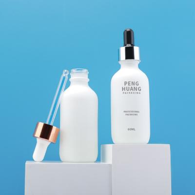 Cina 2oz 60ml ha glassato la bottiglia di Boston intorno alla bottiglia di vetro del contagoccia dell'olio per capelli di vetro dell'olio essenziale in vendita