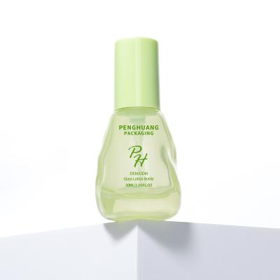 China Avocado Green Clear 30ml Glass Liquid Foundation Bottles For Skincare Packaging for sale