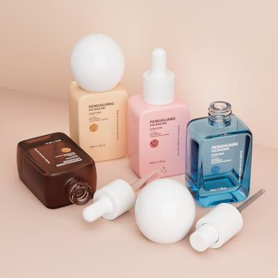 China Empty Wholesale Pump Bottles 30ML Round Ball Cap Square Glass Liquid Foundation Bottles for sale