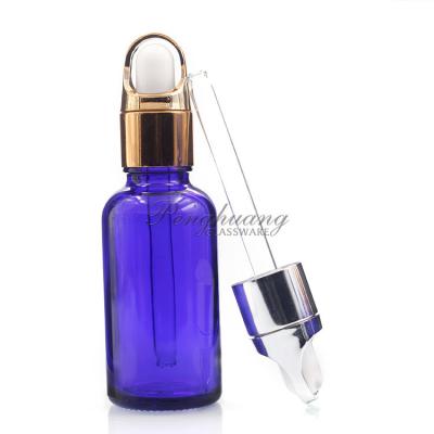 China Cylindrical 30ml Blue Oil Dropper Glass Bottle With Gold Dropper for sale