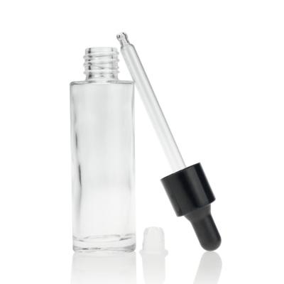China Clear Glass 30ml Serum Dropper Bottles Matte Black Cap Cosmetic Packaging Bottle for sale
