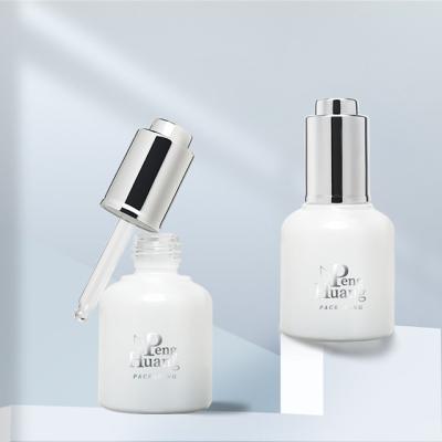 China 35ml OEM White Skin Care Bottle Glass Container With Dropper for sale