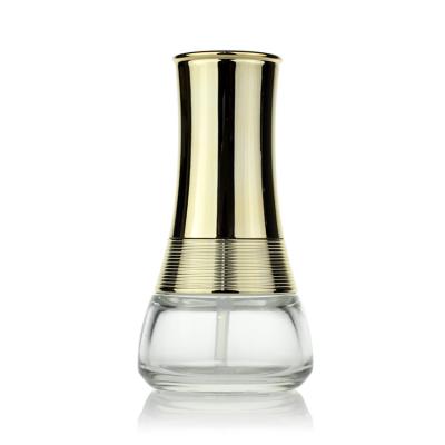 China 30ml 100ml 120ml Cosmetic Container Packaging Clear Glass With Gold Cap for sale