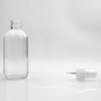 China Liquid 120ml Clear Boston Glass Bottles With Pump Spray for sale