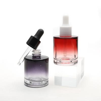 China Luxury Fat 40ml Glass Liquid Foundation Bottles Round Colored for sale