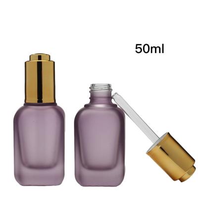 China Custom Square Cosmetic Glass Bottle 50ml Flat Shoulder Push Button Dropper Bottle for sale