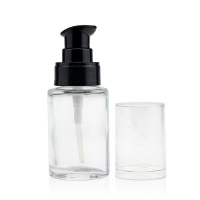 China 30ml Round Shape Glass Empty Foundation Bottle With Press Pump for sale