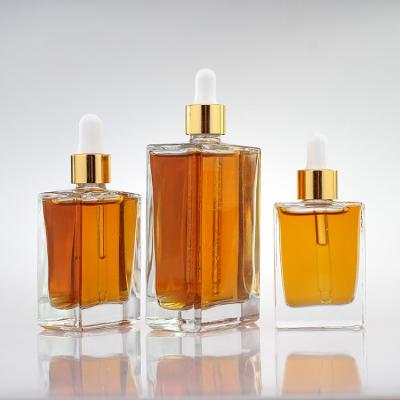 China Transparent Custom Logo Bottle 30ml 50ml 100ml With Gold Dropper for sale