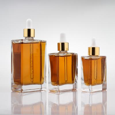China Transparent Custom Logo Bottle 30ml 50ml 100ml With Gold Dropper for sale