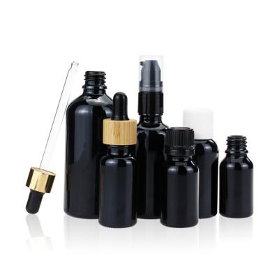 China Empty Violet Black Dropper Screw Cap Glass Bottle for Essential Oil Hair Oil for sale