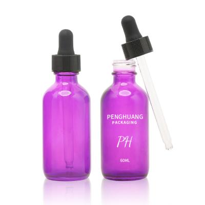 Cina il vetro porpora di 60ml Boston imbottiglia la bottiglia del contagoccia del siero di cura di pelle dell'olio essenziale di massaggio 2oz in vendita