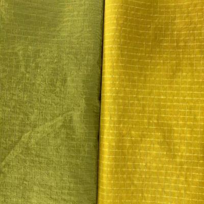 China Water Repellent Coated Fabric Shiny Metal Coated 210D UHMWPE Gridstop Nylon for Jacket for sale