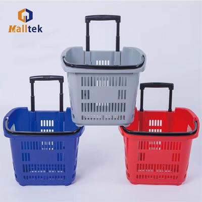 Cina Negozio di comodità Cesto di plastica con due ruote e manico telescopico in alluminio in vendita