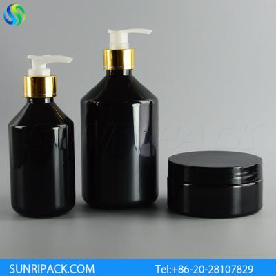 China 250ml/500ml black modern round plastic bottle and golden pump, 250g black plastic jar for sale