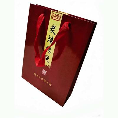 China Red Art Paper Bags Reusable Heavy Duty Paper Bags Customized With PP Handle for sale
