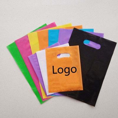 China Lightweight Die Cut Handle Plastic Bag Glossy / Matte / Frosted Retail Plastic Shopping Bags for sale