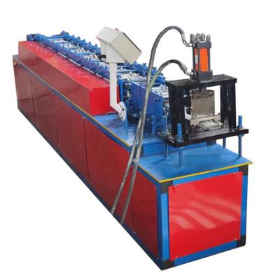 China Metal Shutter Door Roll Forming Machine With 10-15m/Min Forming Speed And 45 Steel Rollers for sale