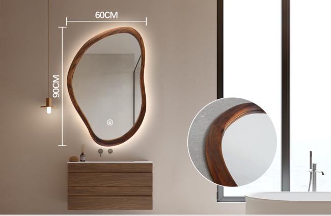 Mirror installation in modern bathroom setting showing lighting effects