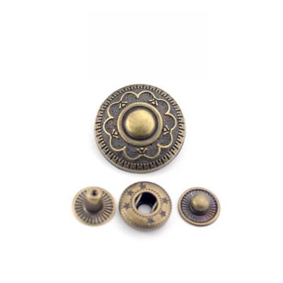 China Custom Embossed Metal Snap Buttons With Logo For Coats Clothes for sale
