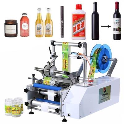 China Semi-automatische industriële flacon etiketteringsmachine voor voedsel blikken en ronde flessen etiketteren Te koop