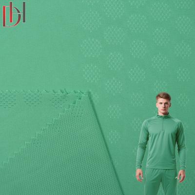 China Garment Breathable Knitted Fabric 100% Polyester Textile Jacquard Clothing Fabric for sale