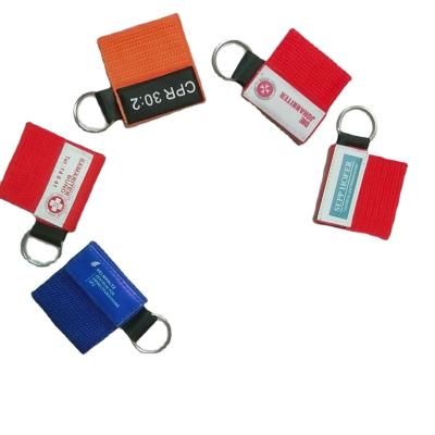 China Custom Red Cross Pocket Cpr Mask Keychain With Gloves First Aid Face Shield Bag Pouch for sale