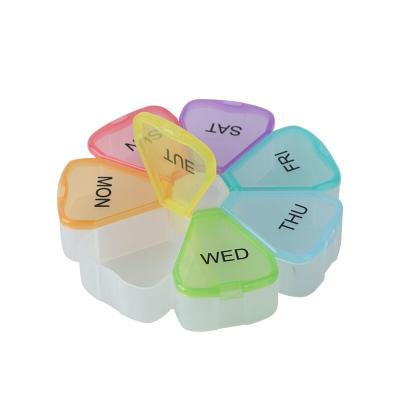 China 12*2.4cm 7 Compartments Food Grade Material Flower Shape Pill Box and Organizer for sale