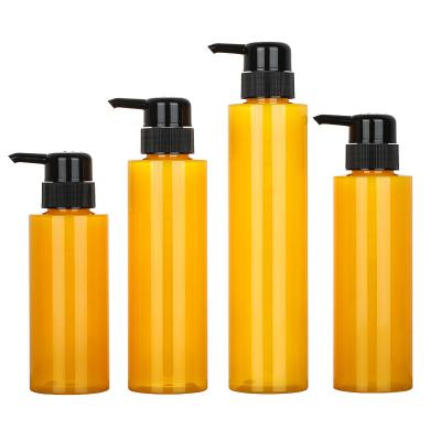 China Bomba de loção redonda PET personalizada Frasco de shampoo Cilindro de cor amarela à venda