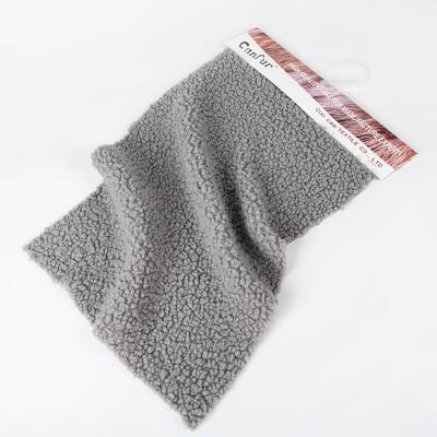 China Gepersonaliseerde warme en zachte teddy fleece stof voor kleding 100% polyester breedte 58/60 Te koop