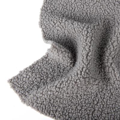 China Gepersonaliseerde warme en zachte teddy fleece stof voor kleding 100% polyester breedte 58/60 Te koop