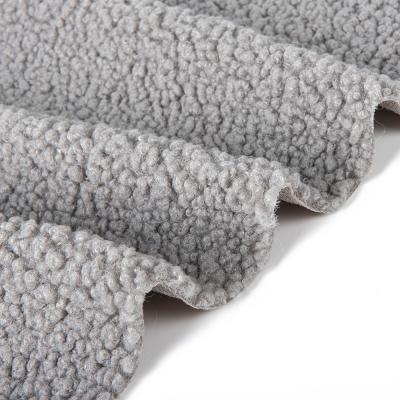 China Gepersonaliseerde warme en zachte teddy fleece stof voor kleding 100% polyester breedte 58/60 Te koop