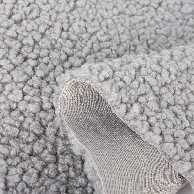 China Gepersonaliseerde warme en zachte teddy fleece stof voor kleding 100% polyester breedte 58/60 Te koop