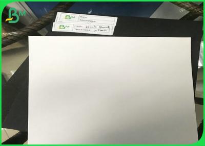 China 1mm 1.5mm 2.0mm 2.5mm 3.0mm One Face Laminated Black Cardboard With Grey Back for sale