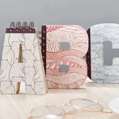 China Custom OEM Letter-Shaped Spiral Notebook with Premium Cover Material and Offset Full-Color Printing for sale