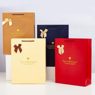 China Paper Gift Shopping Bags with Satin Ribbon Bow Knot Handles for Luxury Retail for sale