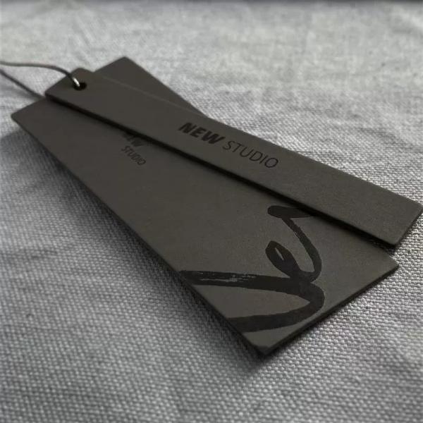 Quality Multi-Layer Black Paper Hang Tags With Spot UV Finish For Apparel Branding for sale