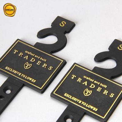 Cina L'oro sventa timbrando il gabinetto di Logo Plastic Belt Hangers For in vendita