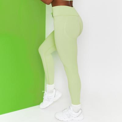 China Seamless knitted striped solid color hip yoga pants sports running fitness leggings women for sale