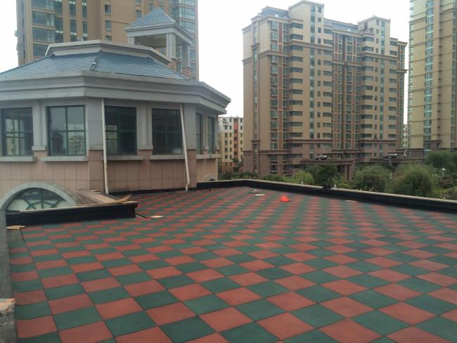 High density rubber floor mats in multiple colors arranged in pattern