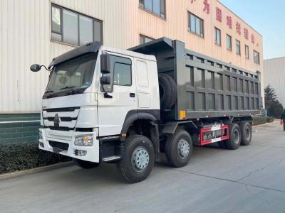 China Gebruikte Sinotruk HOWO 8X4 12 banden 400 pk 30m3 zware vrachtwagen met 20cbm emmer Te koop